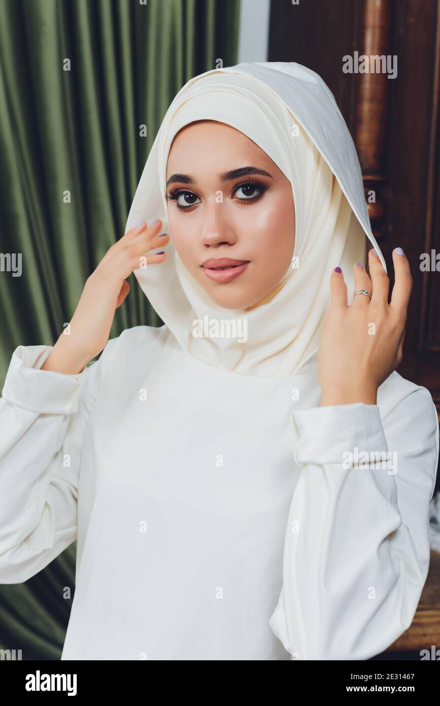 portrait of a beautiful Muslim woman in traditional Islamic clothing ...