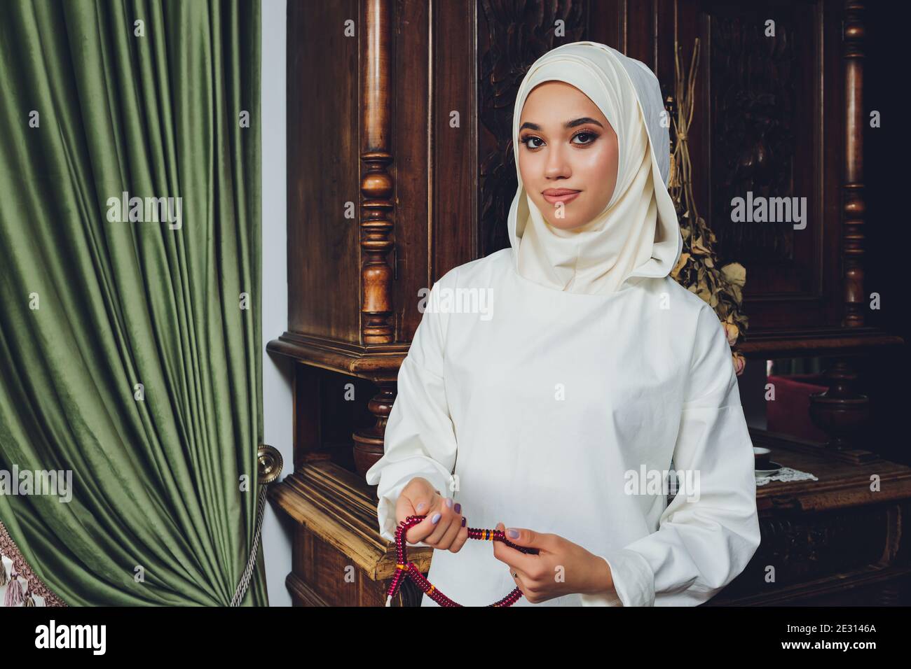 Religious Asian buddhist woman praying with hand holding rosary beads ... Religious Asian buddhist woman praying with hand holding rosary beads ...