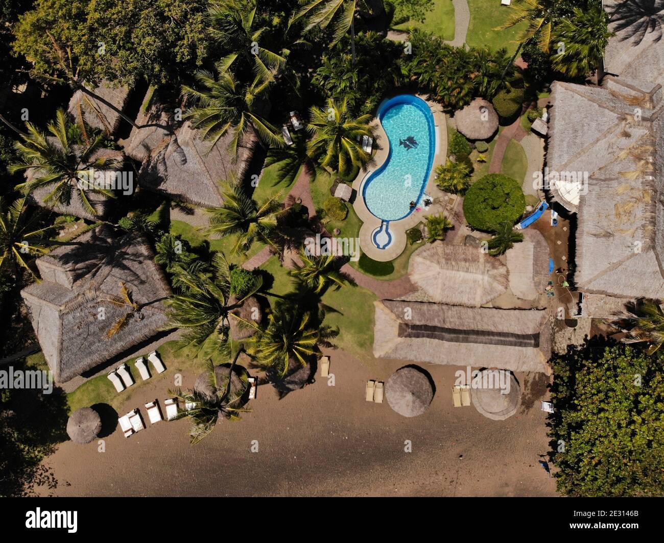 Aerial view of a luxury hotel resort with an outdoor swimming pool ...