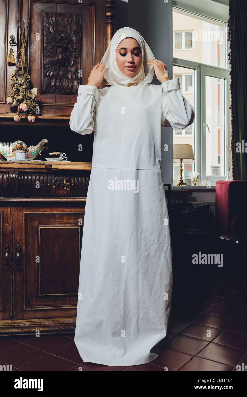 portrait of a beautiful Muslim woman in traditional Islamic clothing ...