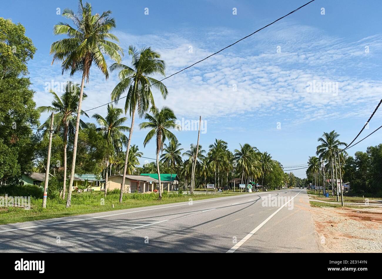 Kampung Merang, Malaysia - July, 2015: Road in a small village near the ...