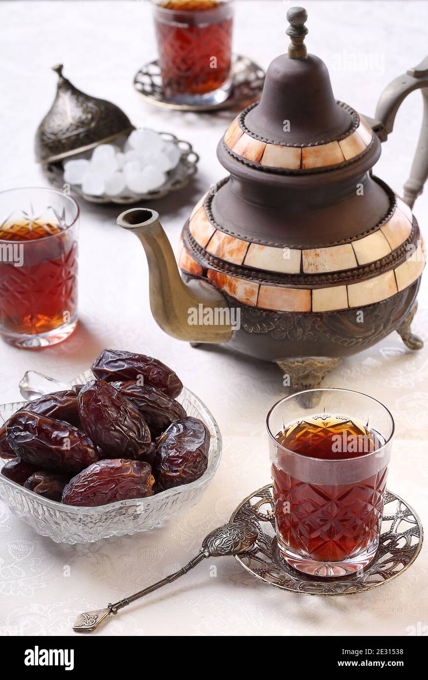 Traditional arabic tea with dry madjool dates and rock sugar nabot ...