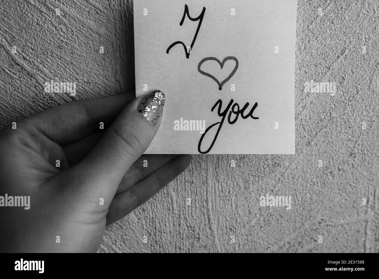 Text I love you on post it. Writing on colorful sticky note. Hand ...