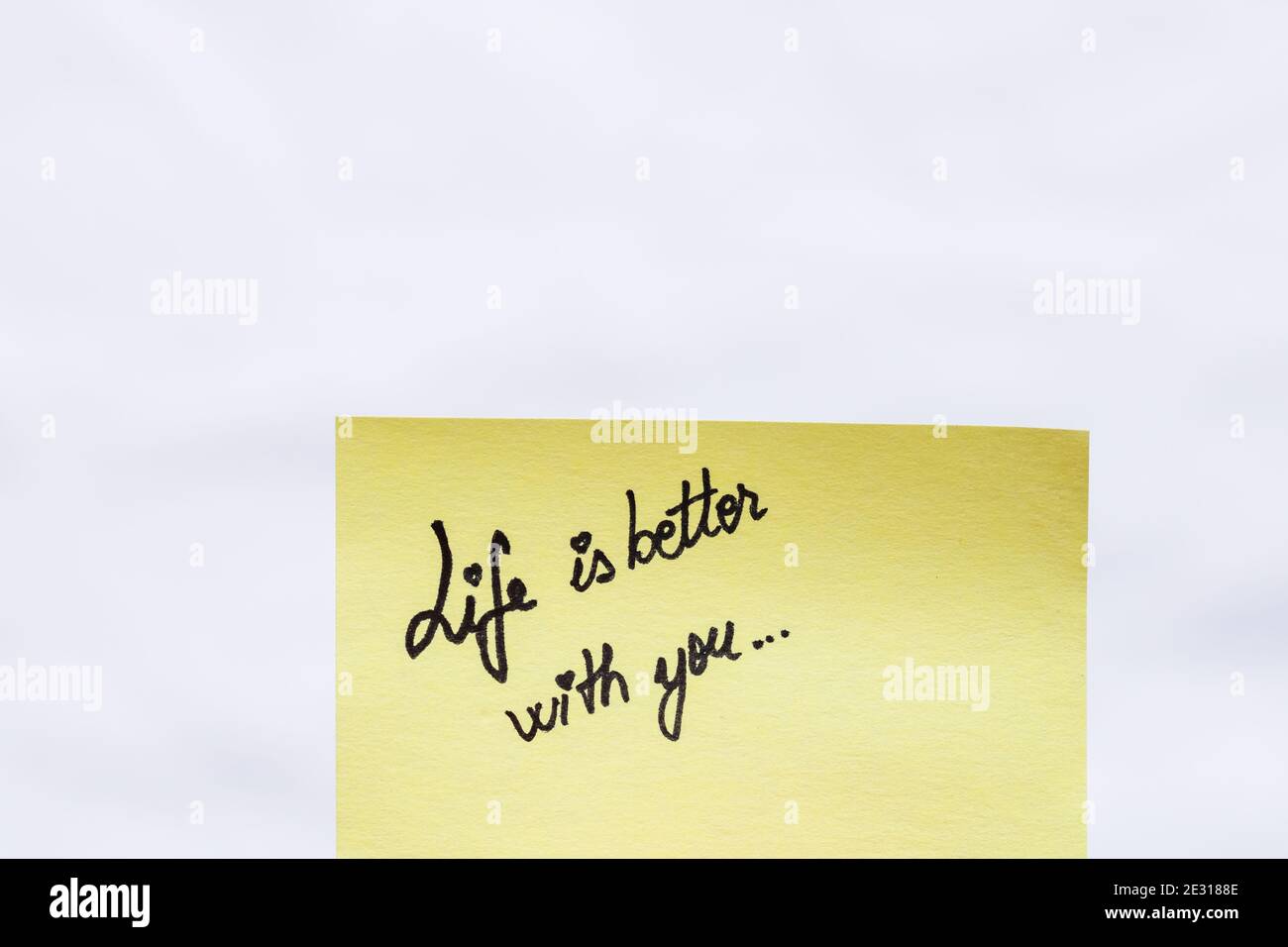 Life is better with you handwriting text close up isolated on yellow ...