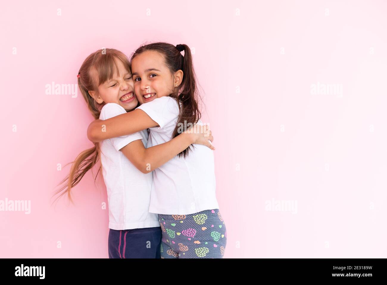Two Little Girls Hugging
