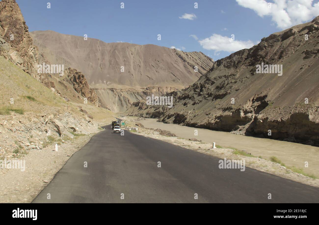 View of a country road between mountains under a clear sky background ...