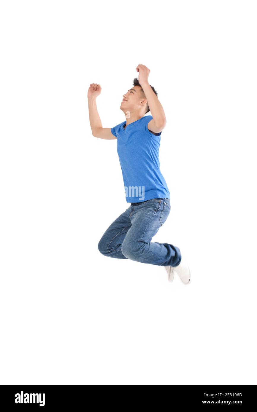 Back view young man jumping air Cut Out Stock Images & Pictures - Alamy