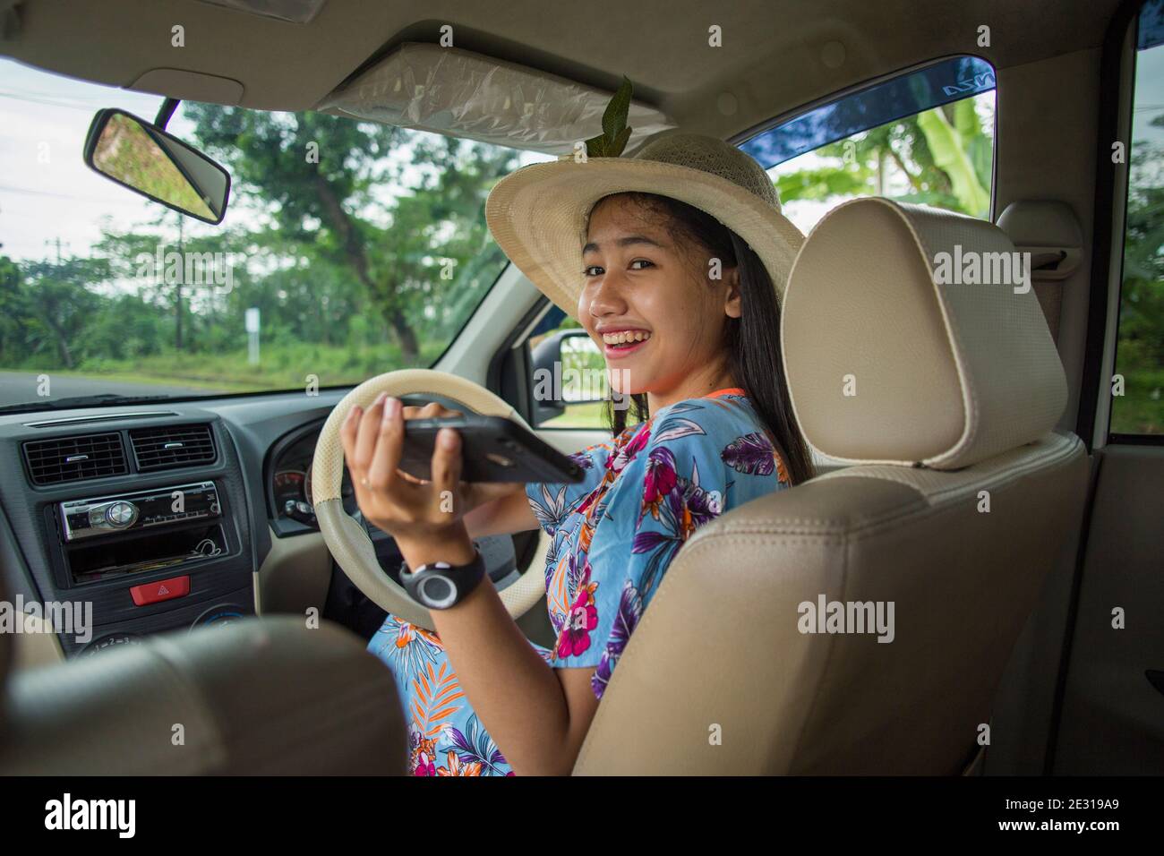 portrait of young asian beauty woman driving a car Stock Photo - Alamy
