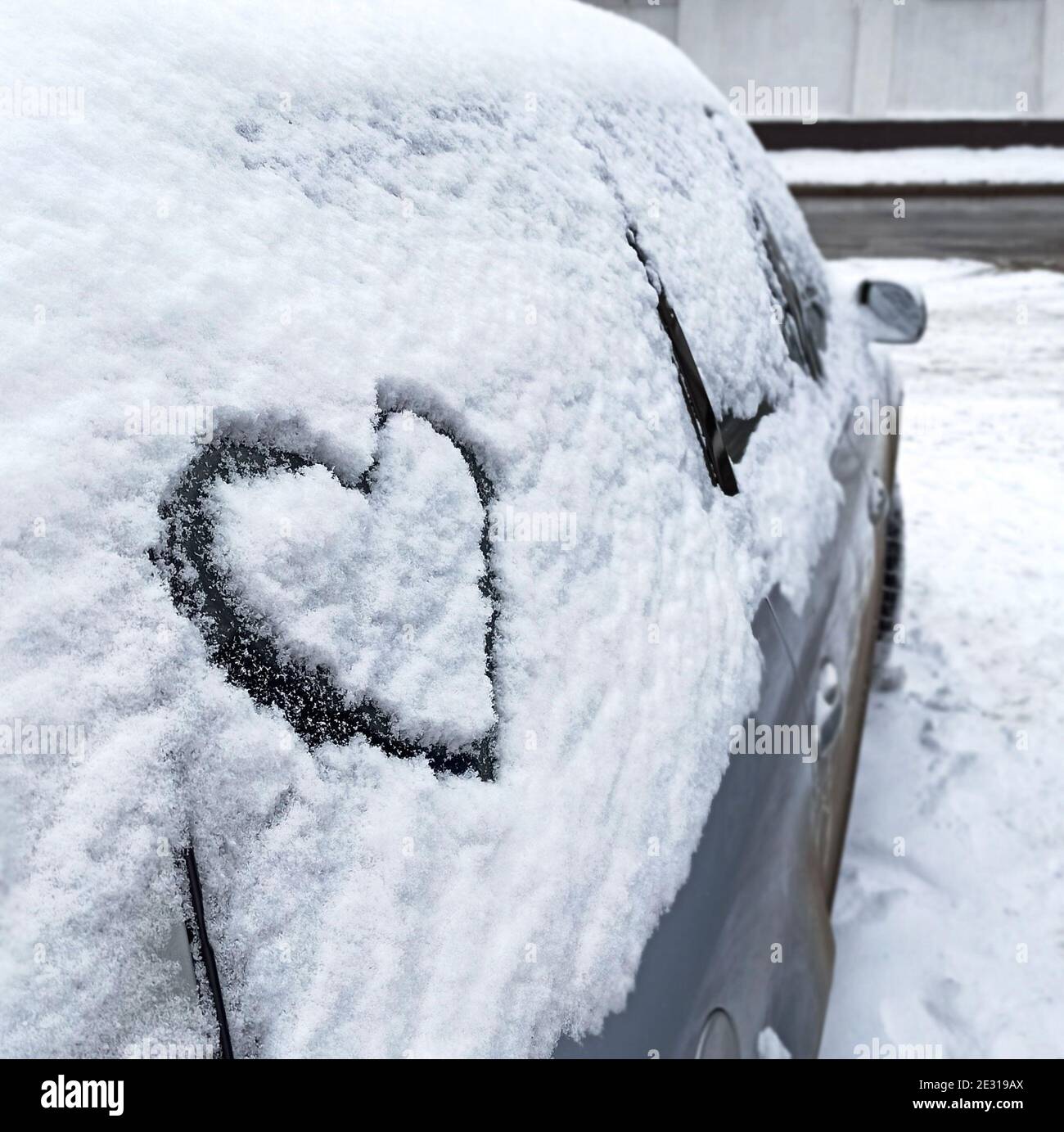 Heart drawn on a snow-covered side window of the car Stock Photo - Alamy