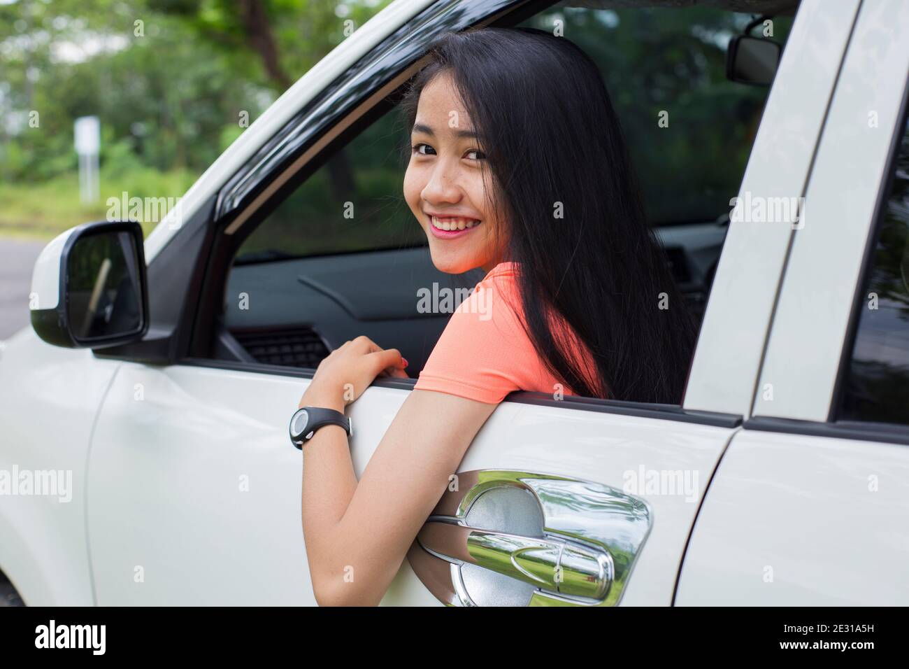 happy young asian woman smiling while sitting in her car Stock Photo ...