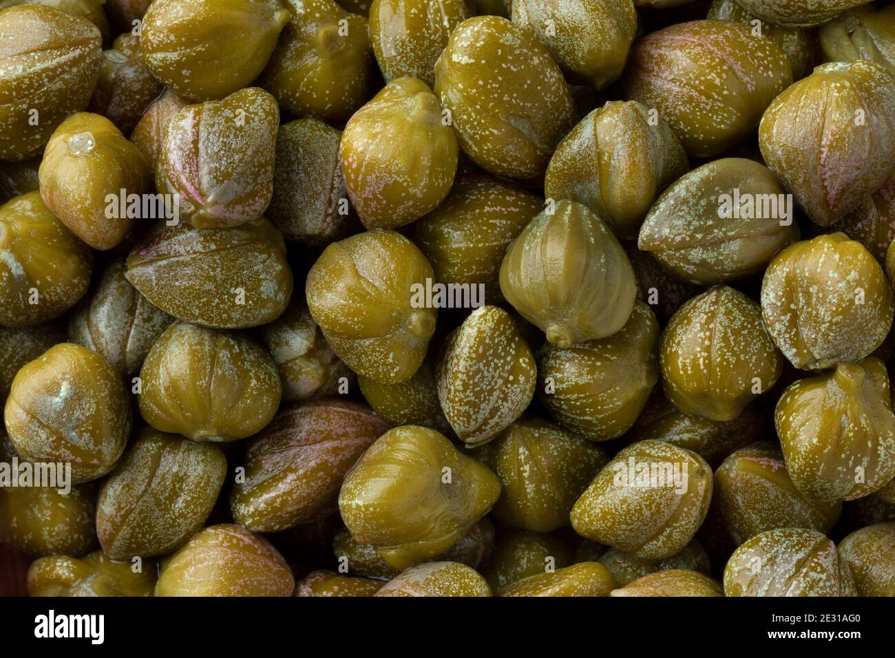 Pickled capers close up full frame as background Stock Photo - Alamy