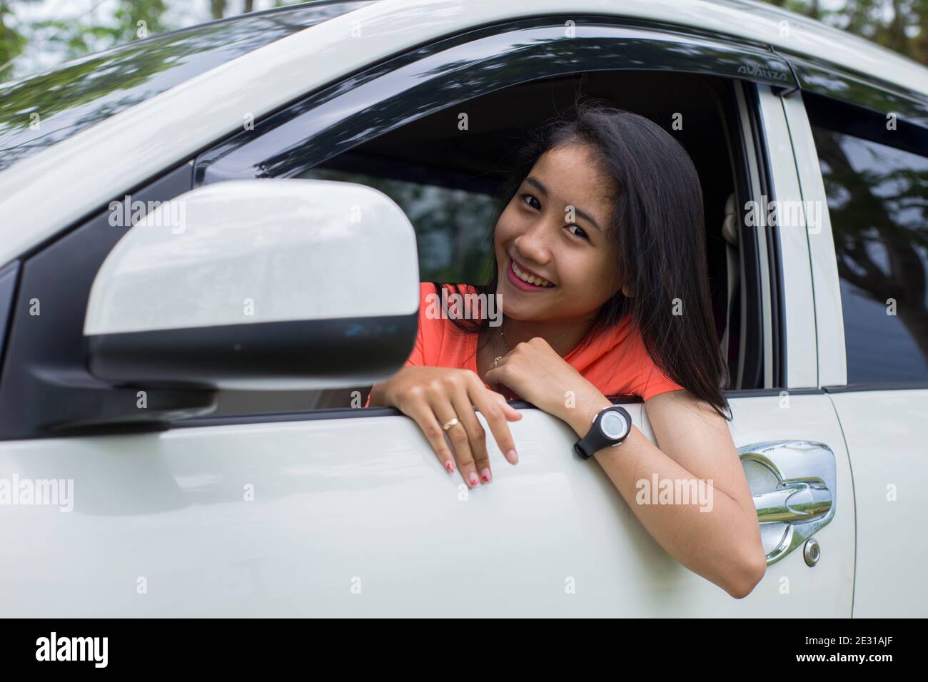happy young asian woman smiling while sitting in her car Stock Photo ...