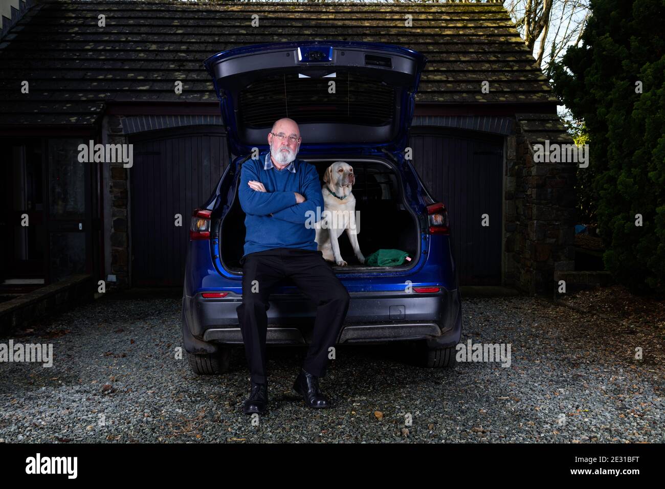 Senior man about to take his dog out for a drive and a walk Stock Photo ...