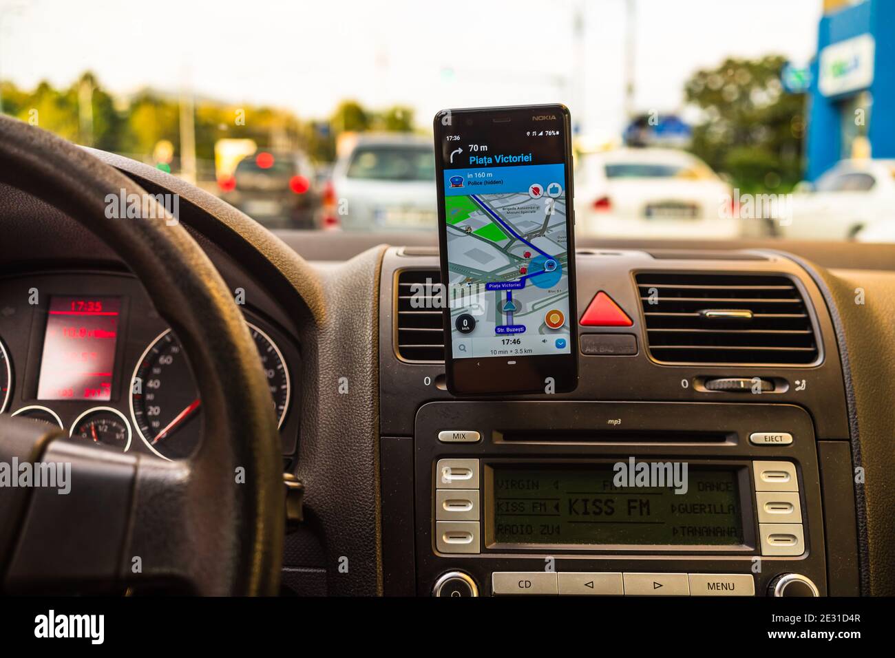 In car dashboard view with smartphone showing Police on Waze maps ...