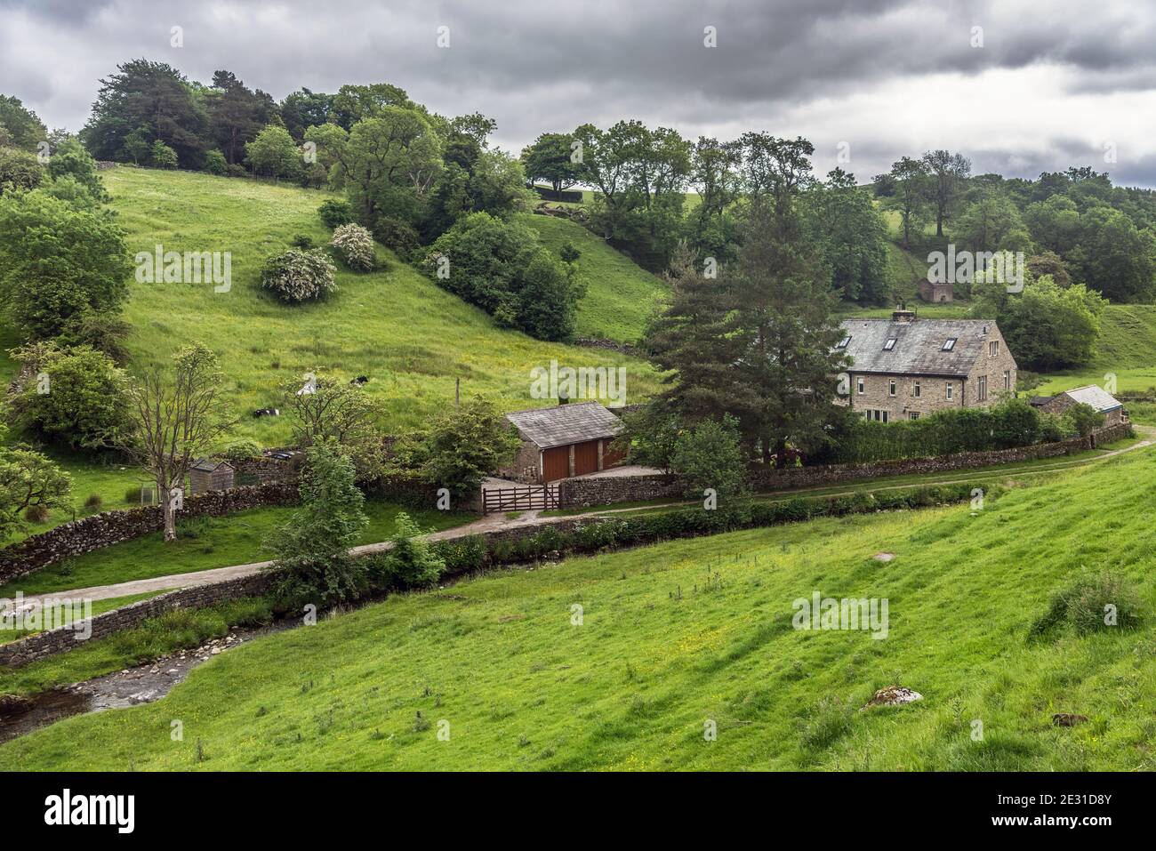 Yorkshire Dales house and farm nestled in the valley creating a picture ...