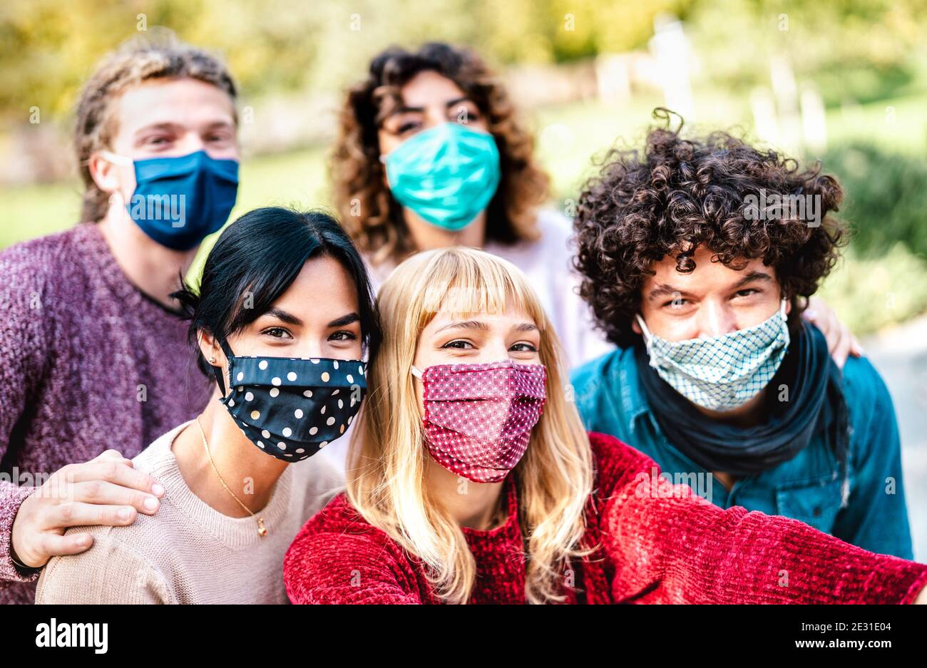 Multiracial people taking selfie wearing face mask and spring clothes ...