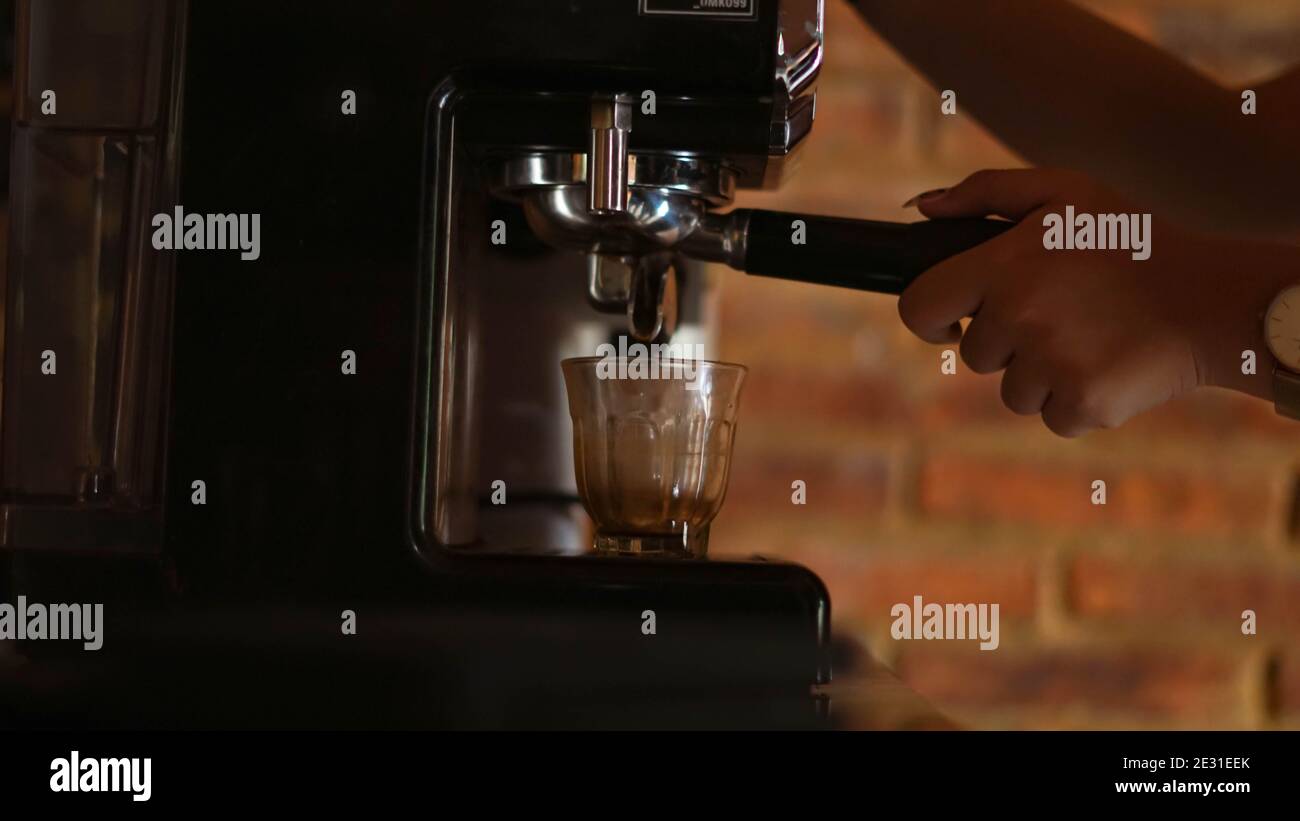 espresso shot from coffee machine make by barista in coffee shop cafe ...