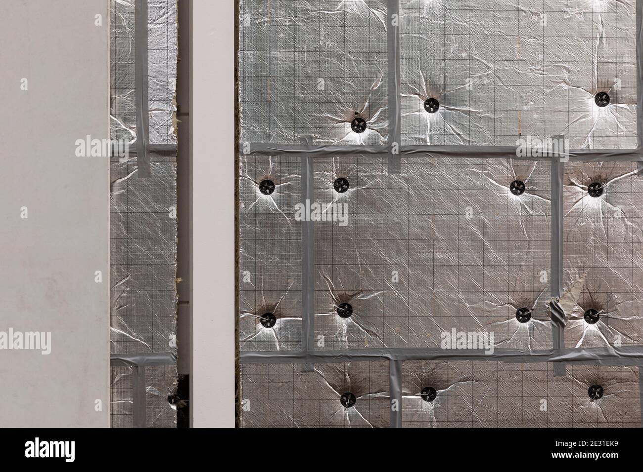 Silver aluminum insulation foil on walls to create a more energy saving ...