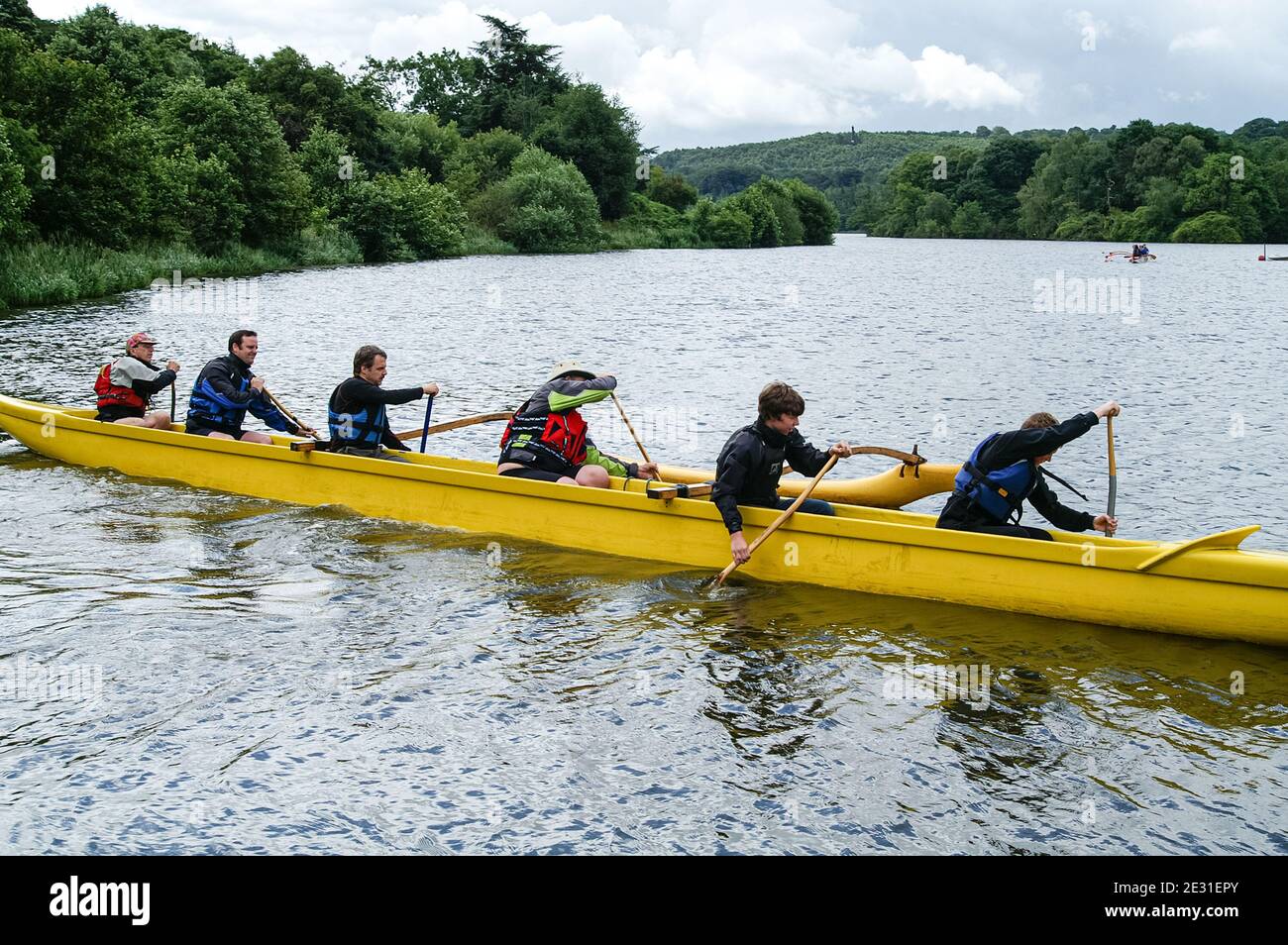 People paddling V6 Hawaiian outrigger canoes (known as va'a), UK Stock ...