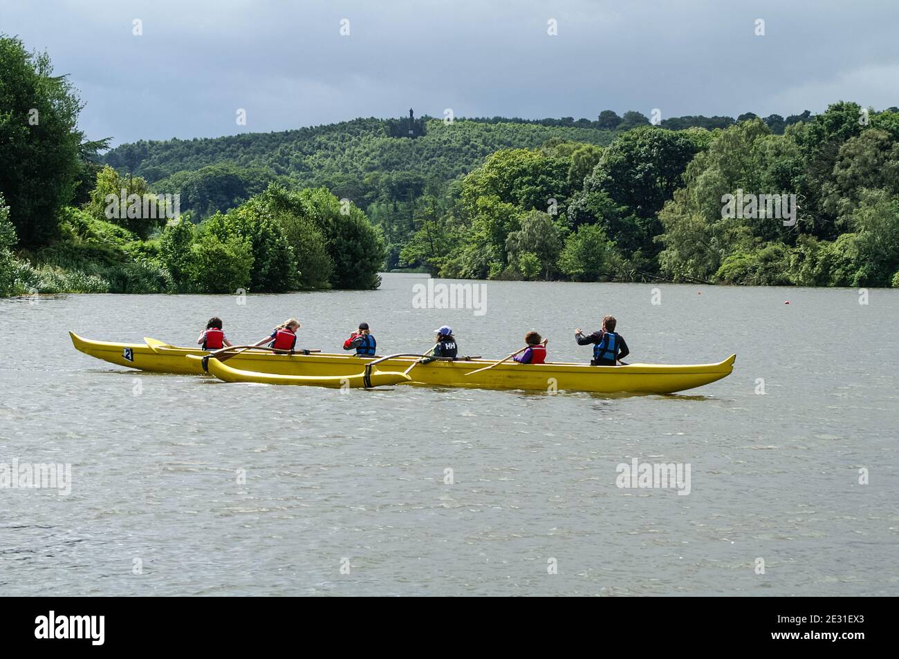 People paddling V6 Hawaiian outrigger canoes (known as va'a), UK Stock ...