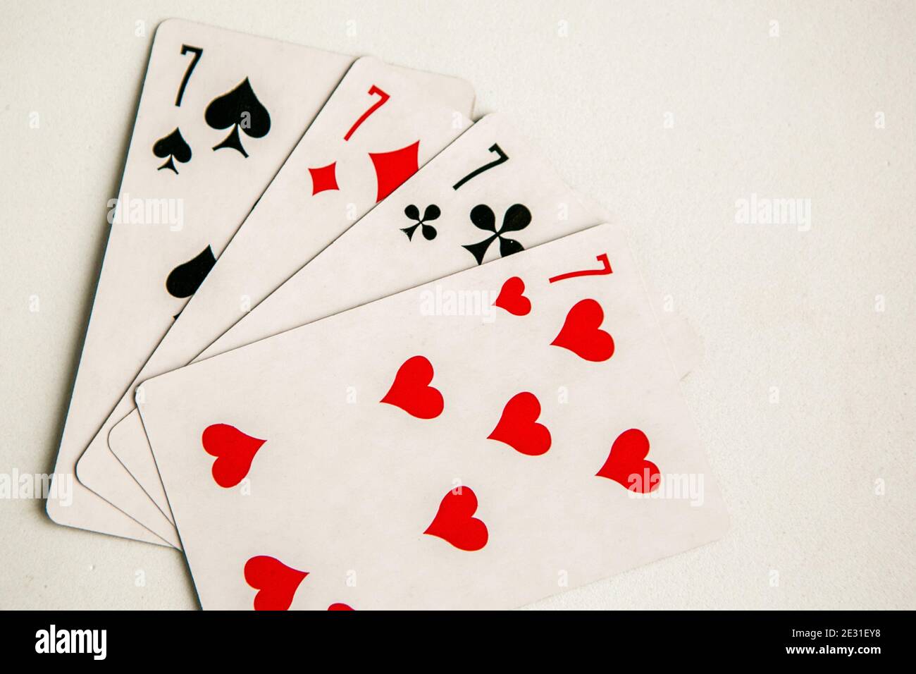 Poker quads playing card, white background Stock Photo - Alamy