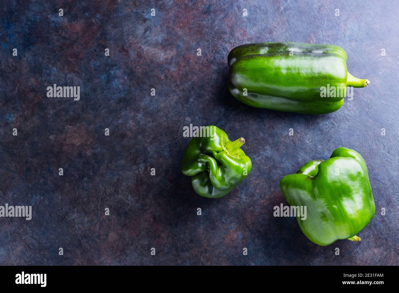 Ugly bell pepper on dark background. Deformed homegrown green bell ...