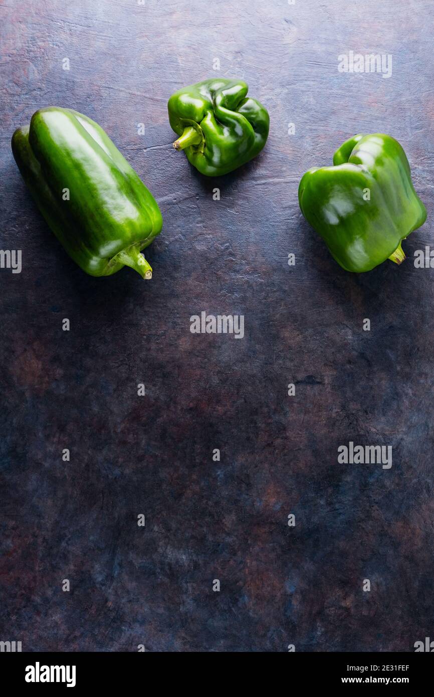 Ugly bell pepper on dark background. Deformed homegrown green bell ...