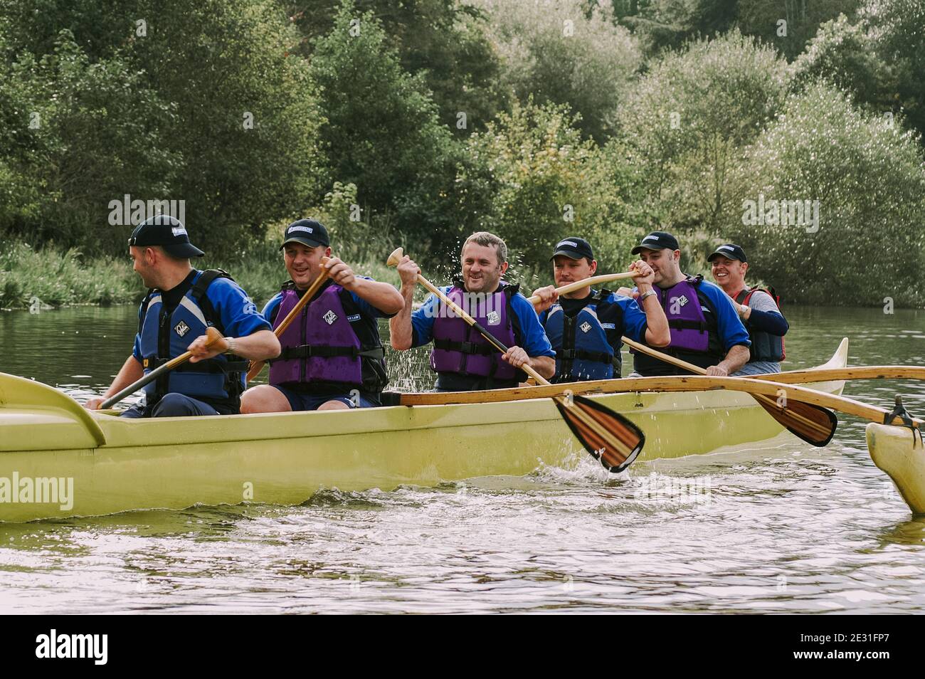 People paddling V6 Hawaiian outrigger canoes (known as va'a), UK Stock ...
