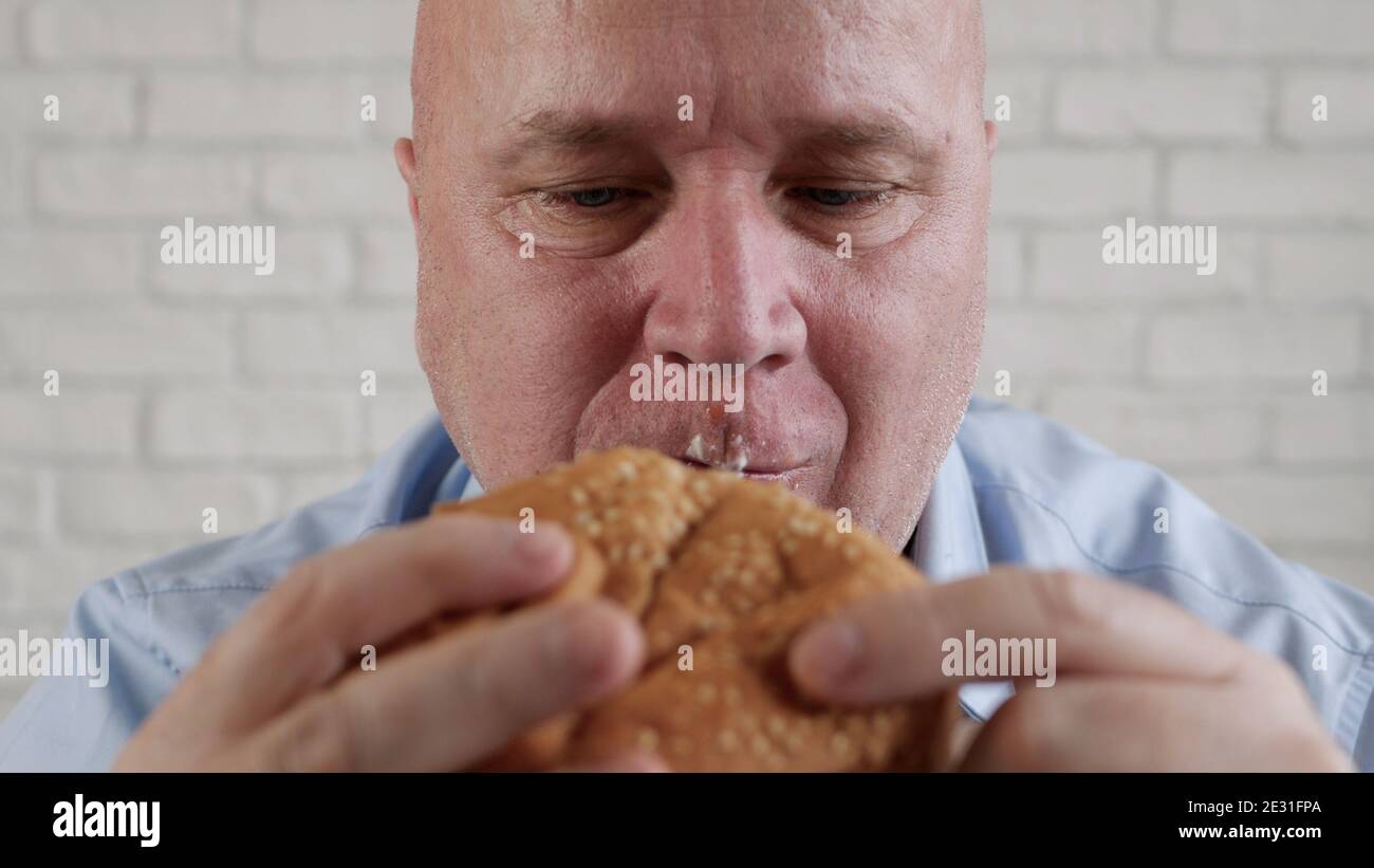 Greedy man eating hi-res stock photography and images - Alamy