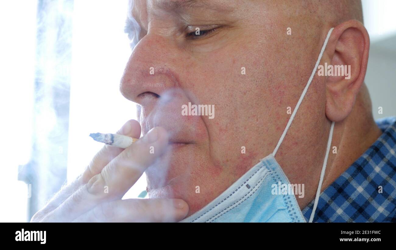 Man With Face Mask Smoking Cigarette High Resolution Stock Photography ...
