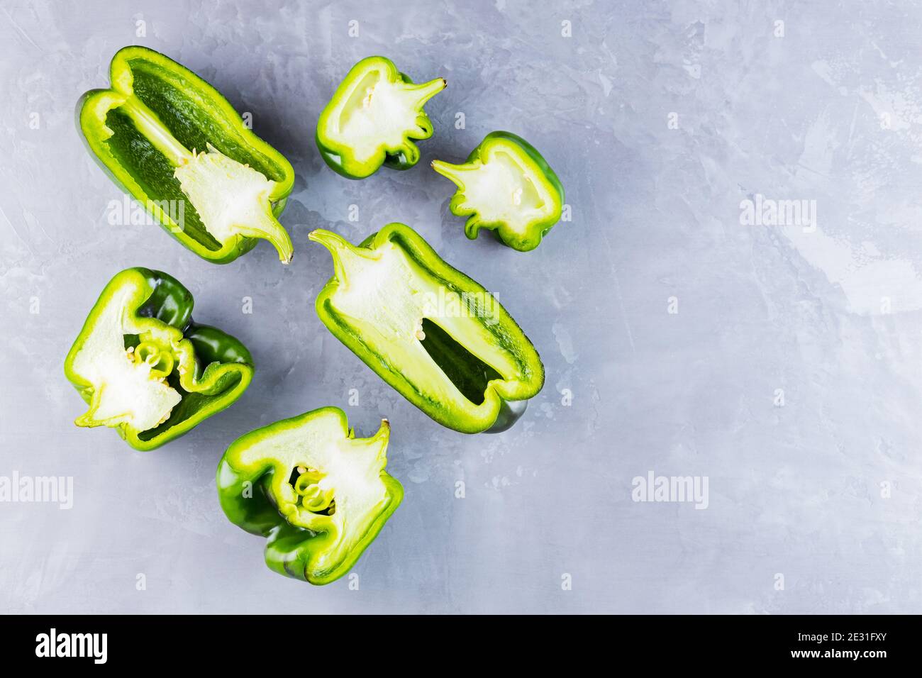 Ugly bell pepper on ultimate gray background. Sliced bell pepper halves ...
