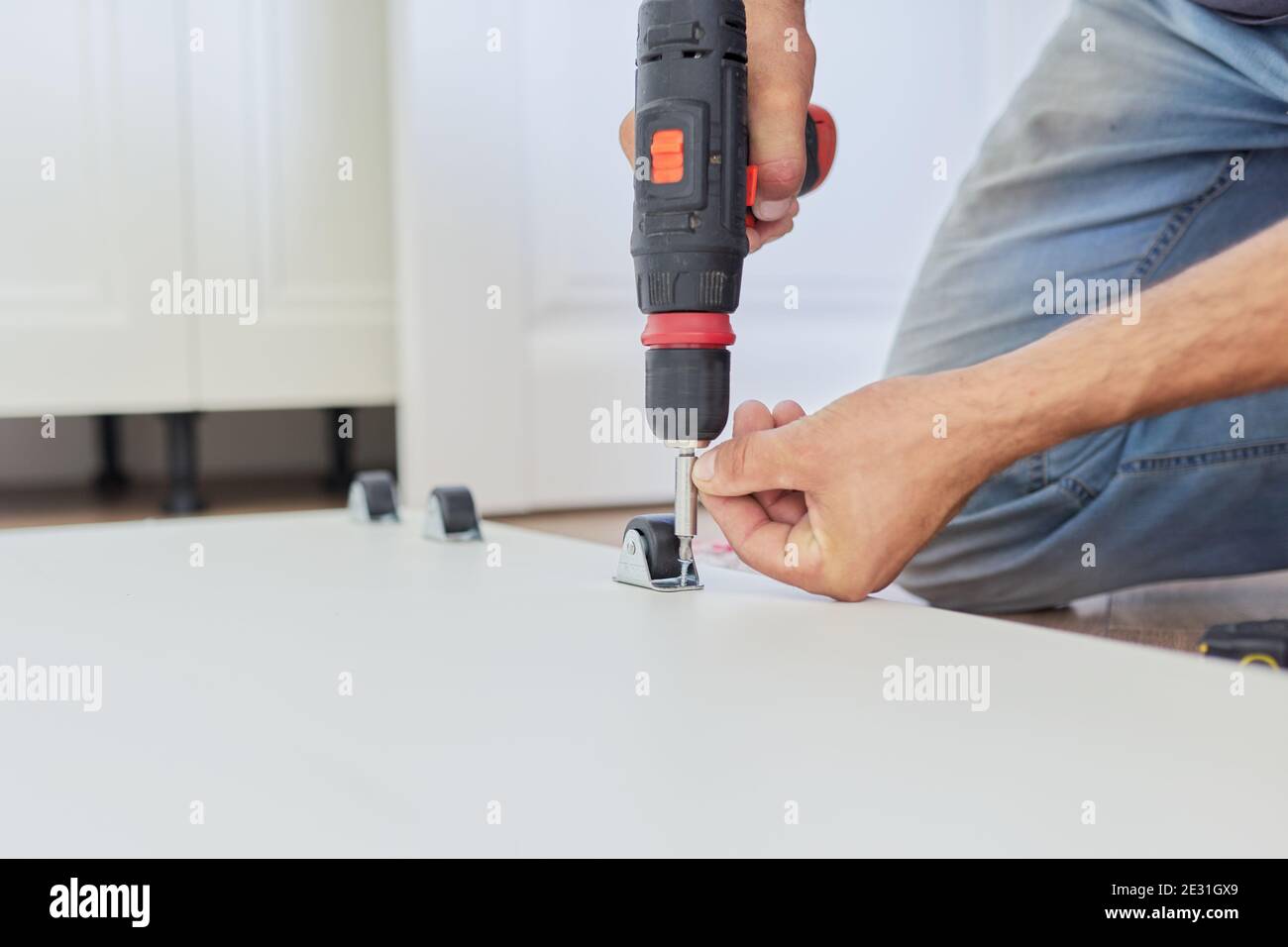 Close up detail of furniture and hands of carpenter worker with ...