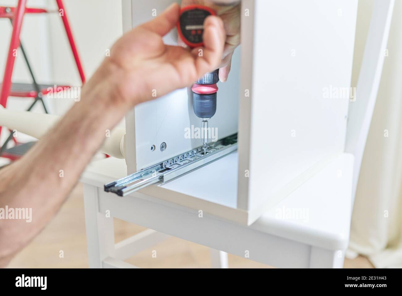 Close up detail of furniture and hands of carpenter worker with ...