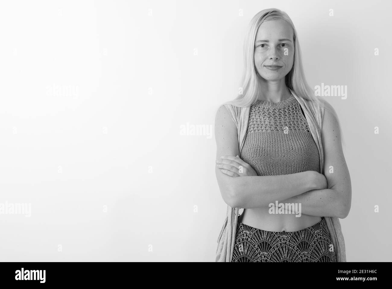 Beautiful blond woman against white background Stock Photo - Alamy