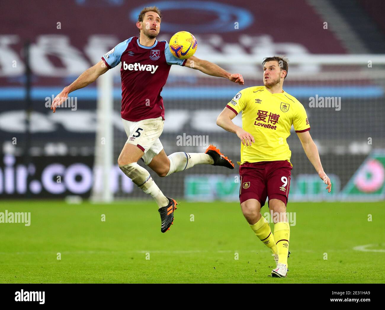 West Ham United's Craig Dawson (left) and Burnley's Chris Wood battle ...