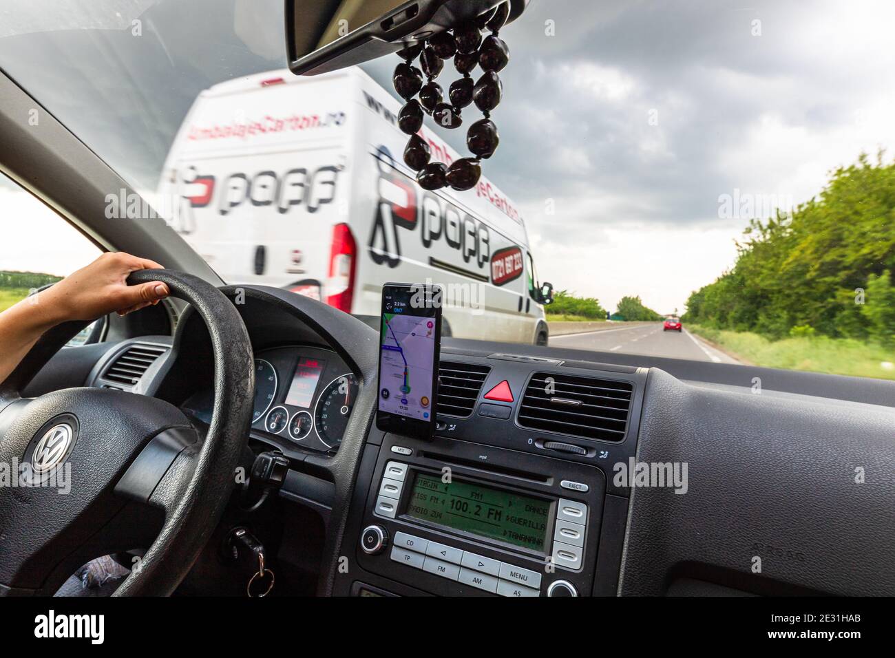 Using waze maps application on smartphone on car dashboard, Driver ...