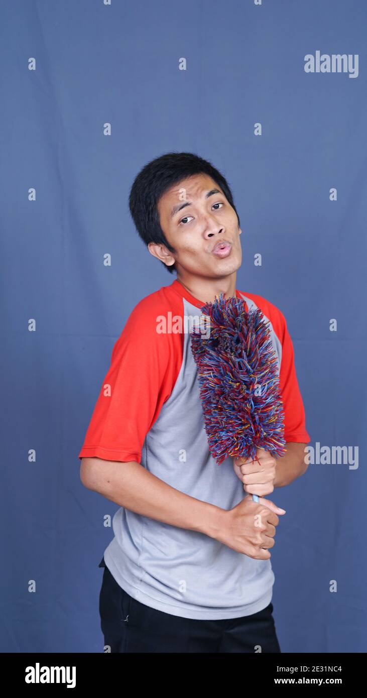 Man with feather duster hi-res stock photography and images - Alamy