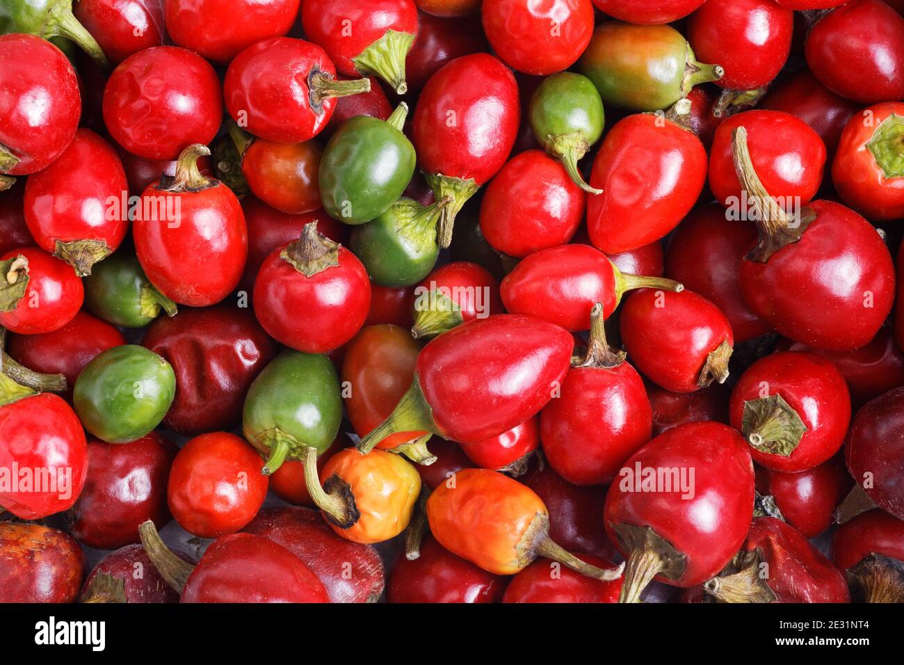 Heap of red and green Hot Cherry Peppers Stock Photo - Alamy