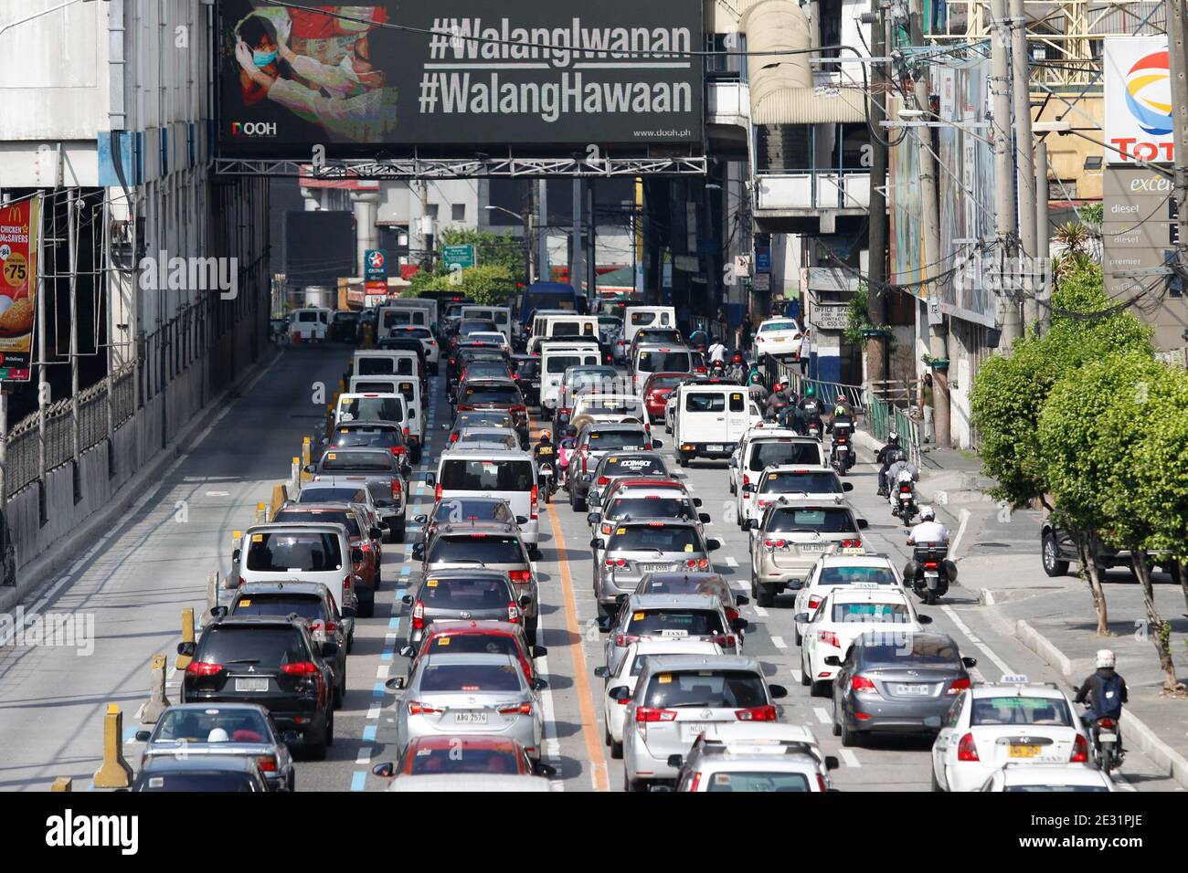 A billboard sign message #Walang Iwanan, #Walang Hawaan" (# ...