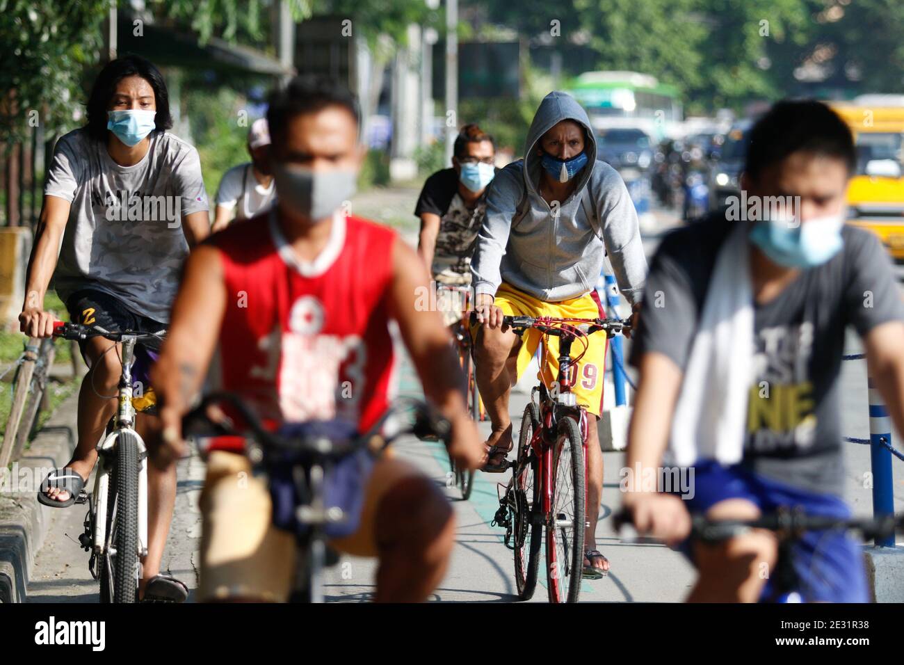 Cyclists riding inside bike lanes along EDSA. Biking became an ...