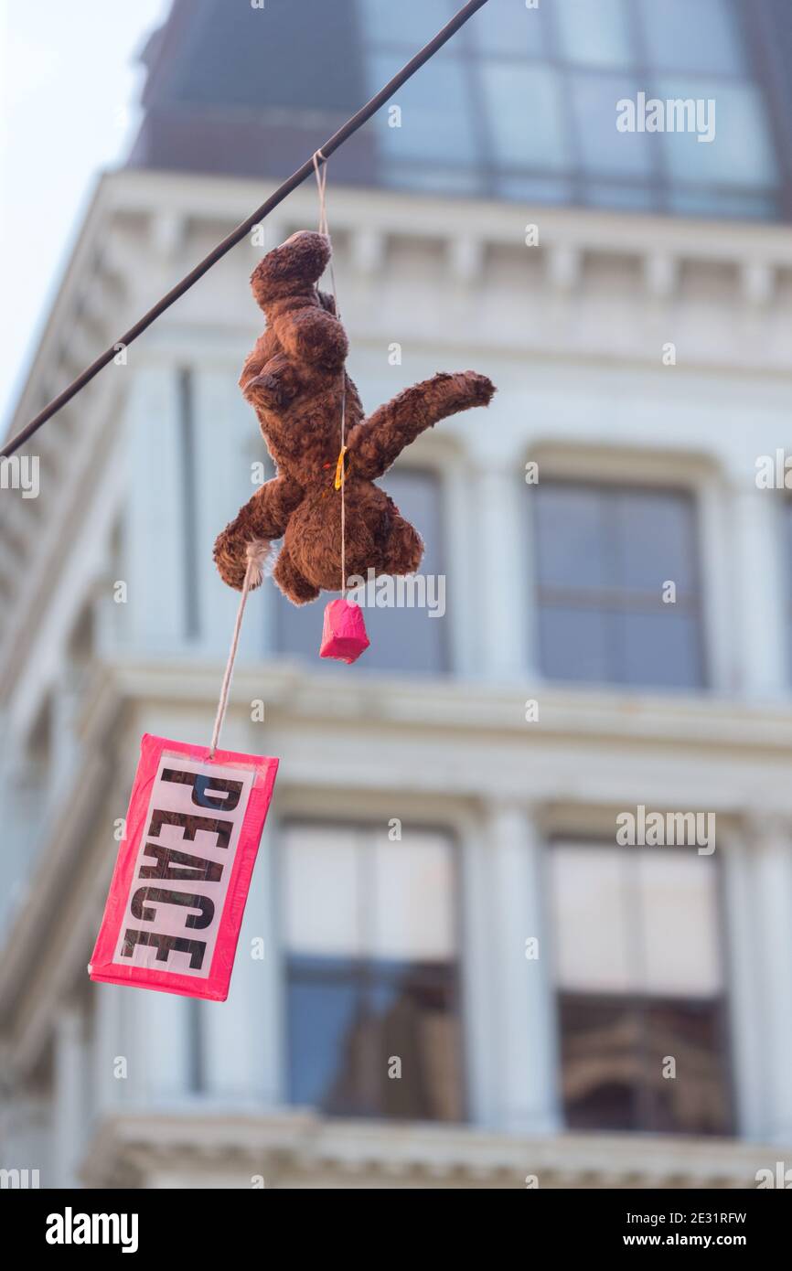 Hanging Teddy Bear With Peace Sign, in SoHo Stock Photo - Alamy