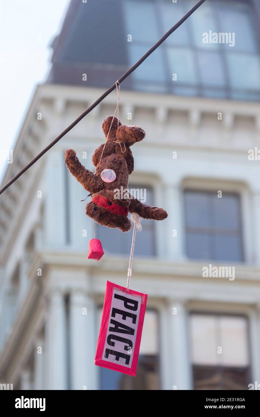 Hanging Teddy Bear With Peace Sign, in SoHo Stock Photo - Alamy