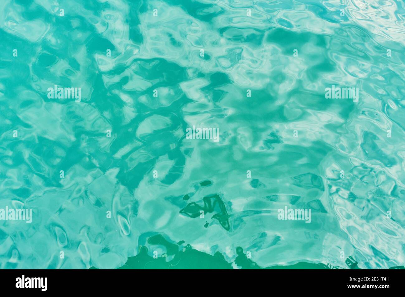 Water texture. Beautiful blue water ripple at the ocean. Light sea ...