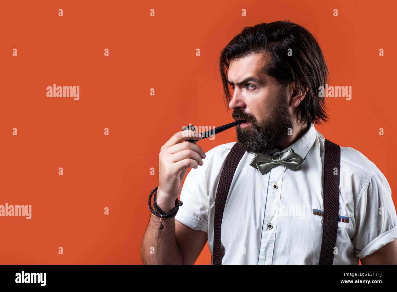 Mature businessman smoking pipe hi-res stock photography and images - Alamy