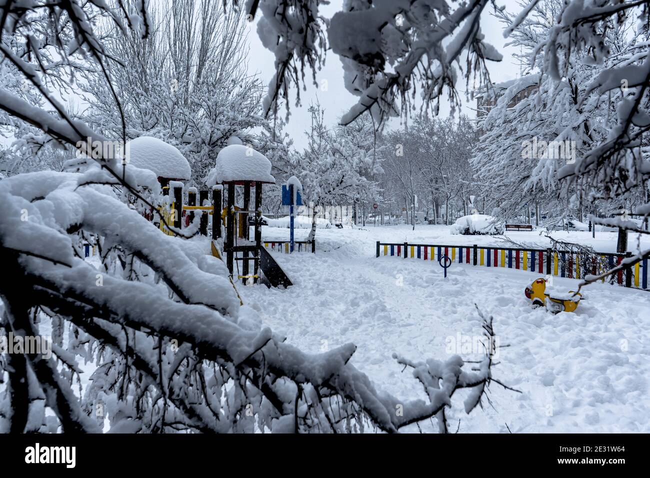 Snowy playground in winter. Empty urban park during snowfall. Scenery ...