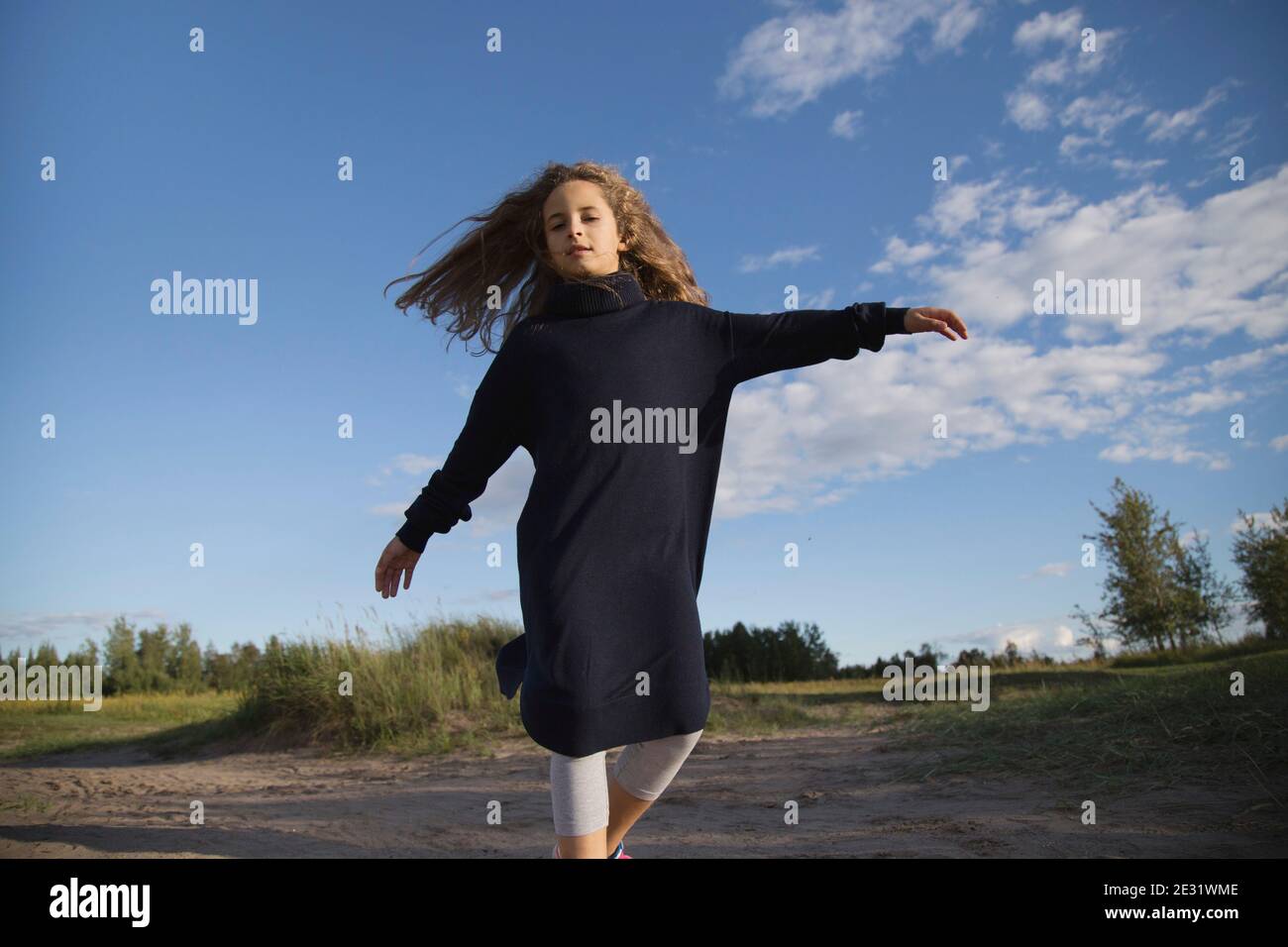 A girl with long hair is spinning close-up Stock Photo - Alamy