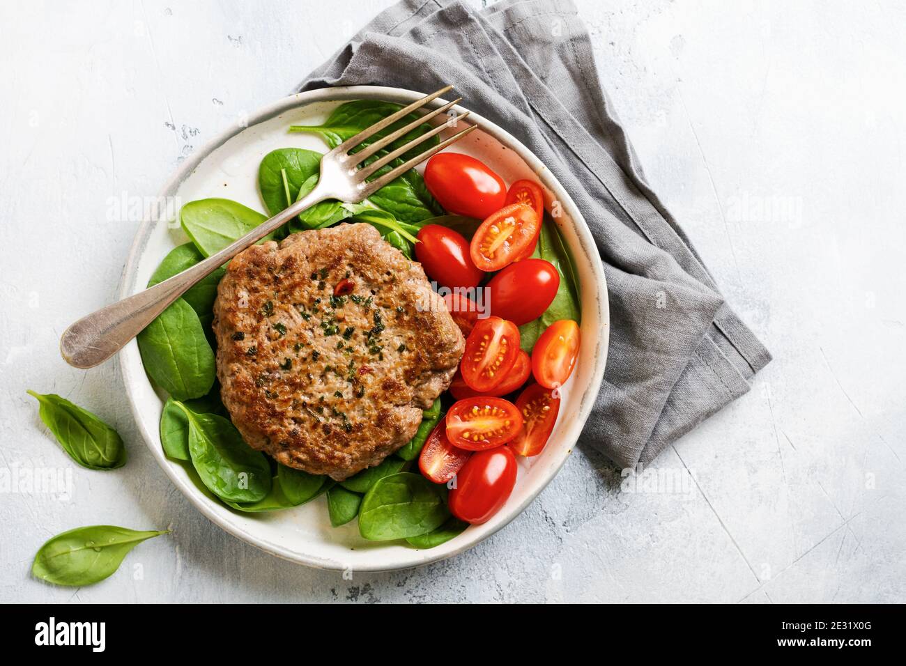 Grilled steak of beef with cherry tomatoes and spinach, garlic ...