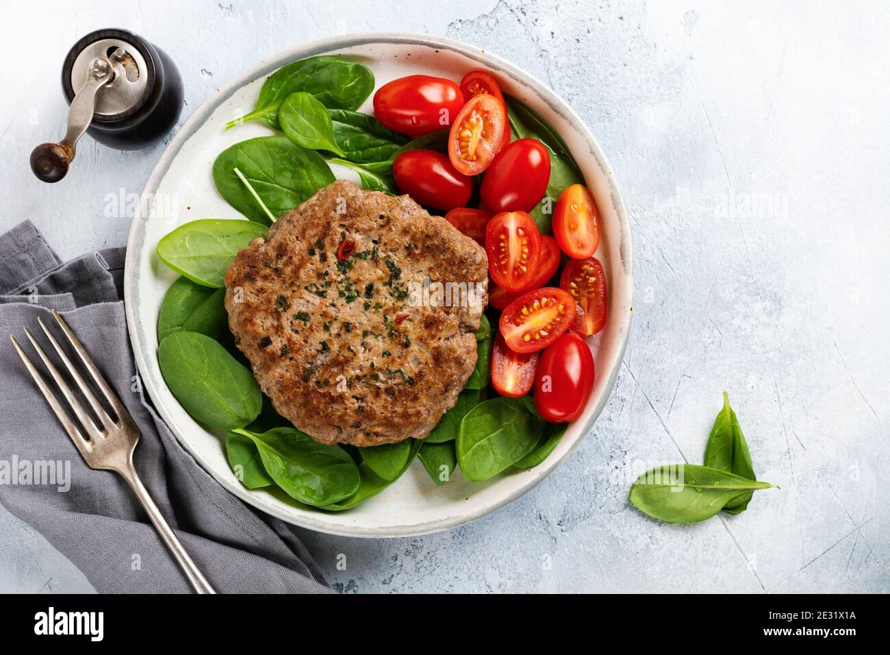 Grilled steak of beef with cherry tomatoes and spinach, garlic ...