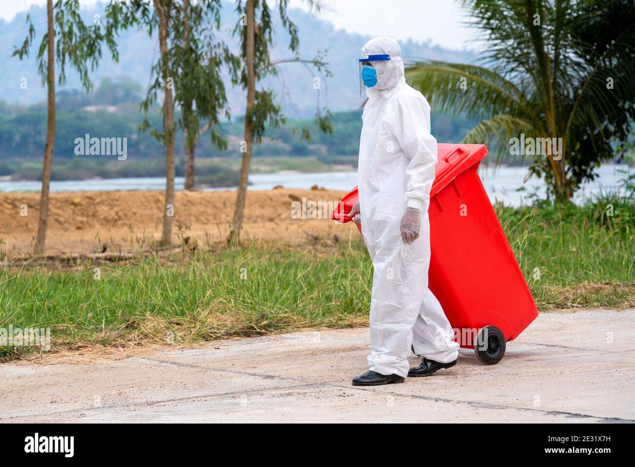 Man wear trash bag hi-res stock photography and images - Alamy