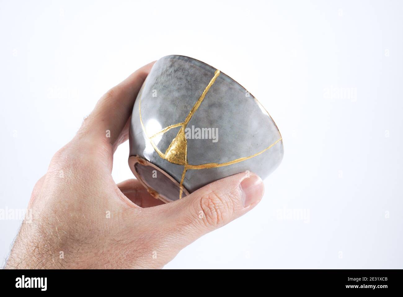 Gray Kintsugi bowl, real gold restoration, japanese technique Stock ...